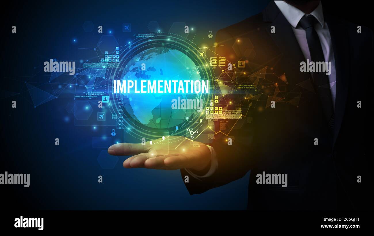 Elegant hand holding IMPLEMENTATION inscription, digital technology ...