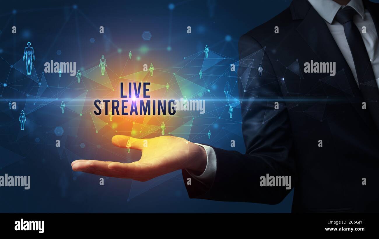Elegant hand holding LIVE STREAMING inscription, social networking ...