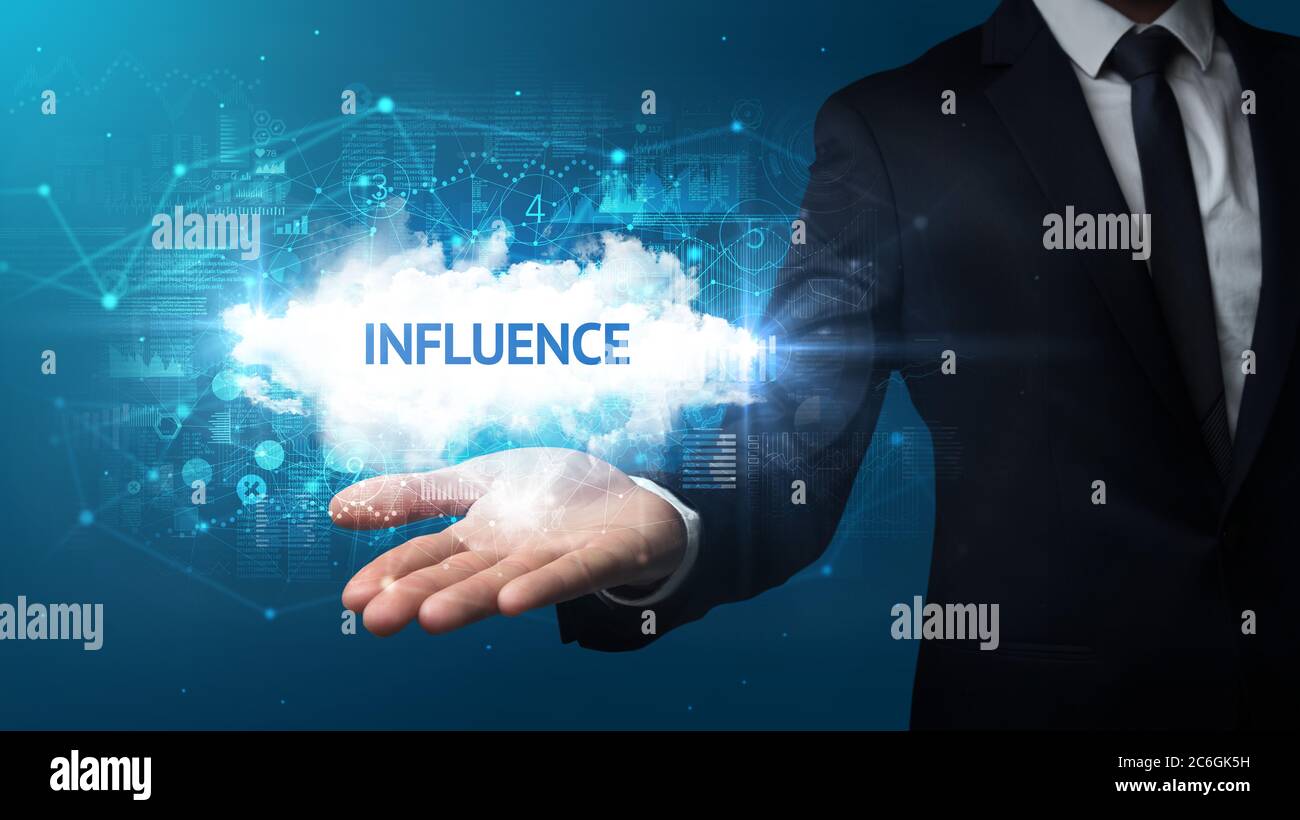 Hand of Businessman holding INFLUENCE inscription, successful business ...