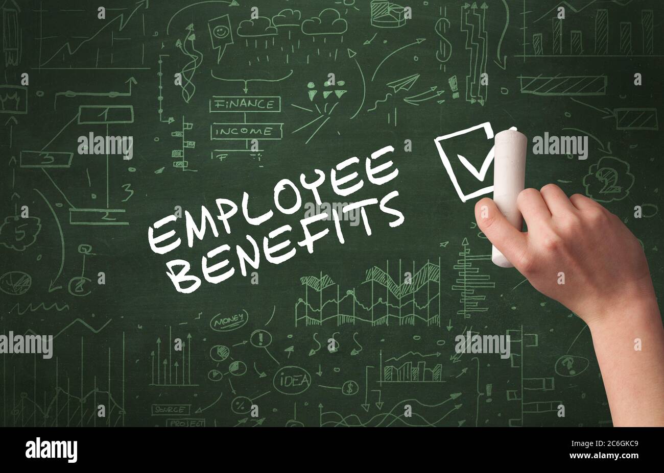 Hand drawing EMPLOYEE BENEFITS inscription with white chalk on ...