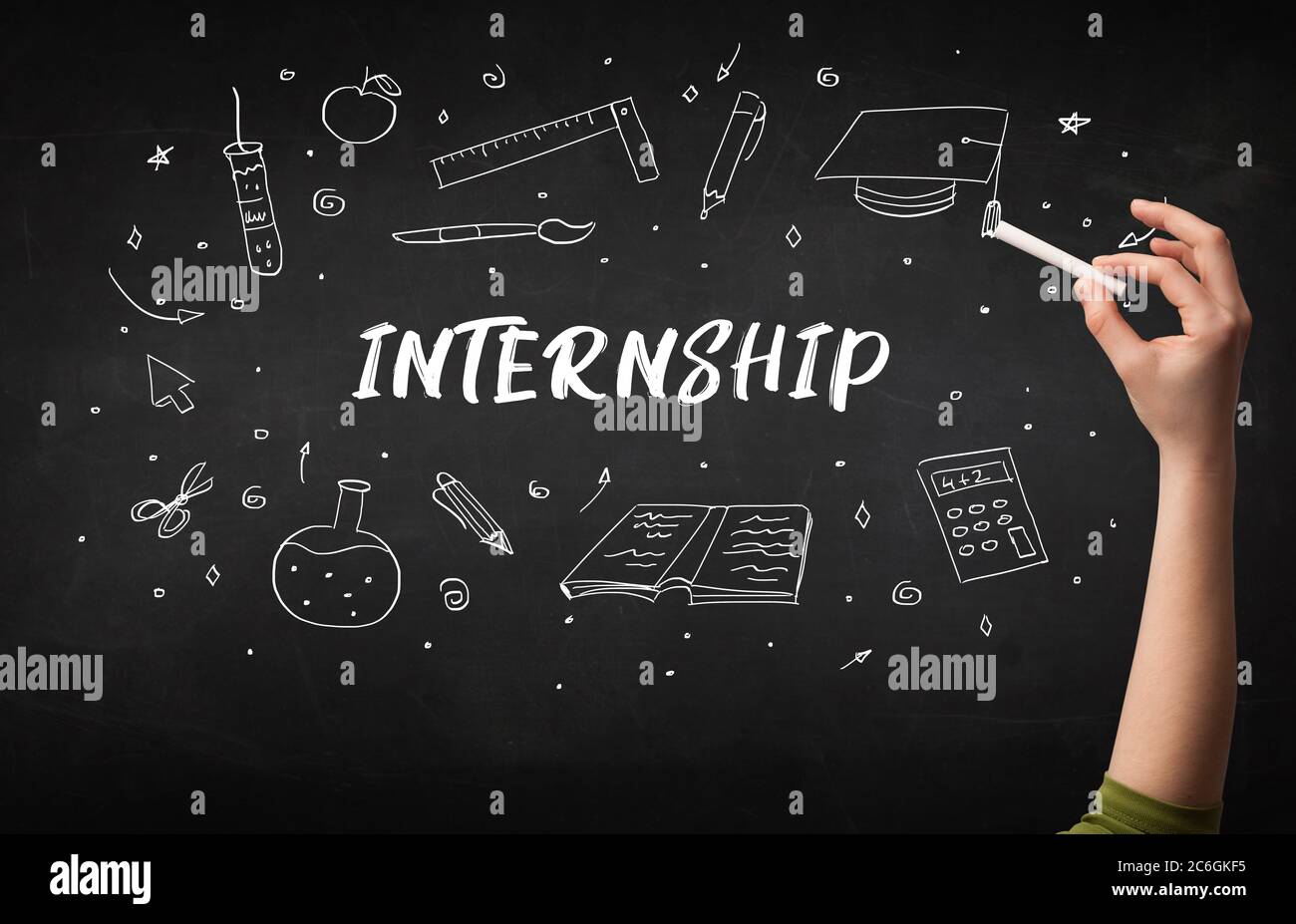 Hand drawing INTERNSHIP inscription with white chalk on blackboard ...