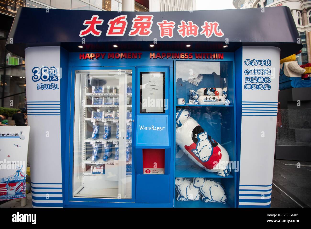 People line up to get a blind box in front of the White Rabbit blind ...