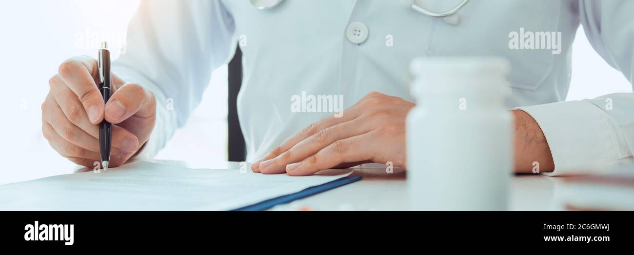 Serious illness doctor writing on hi-res stock photography and images ...