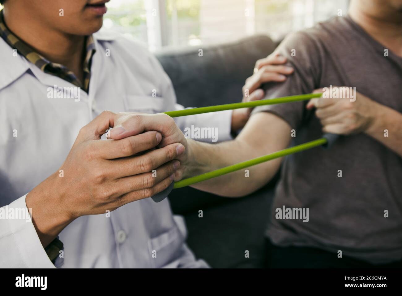 Close up hand patient doing stretching exercise with a flexible ...