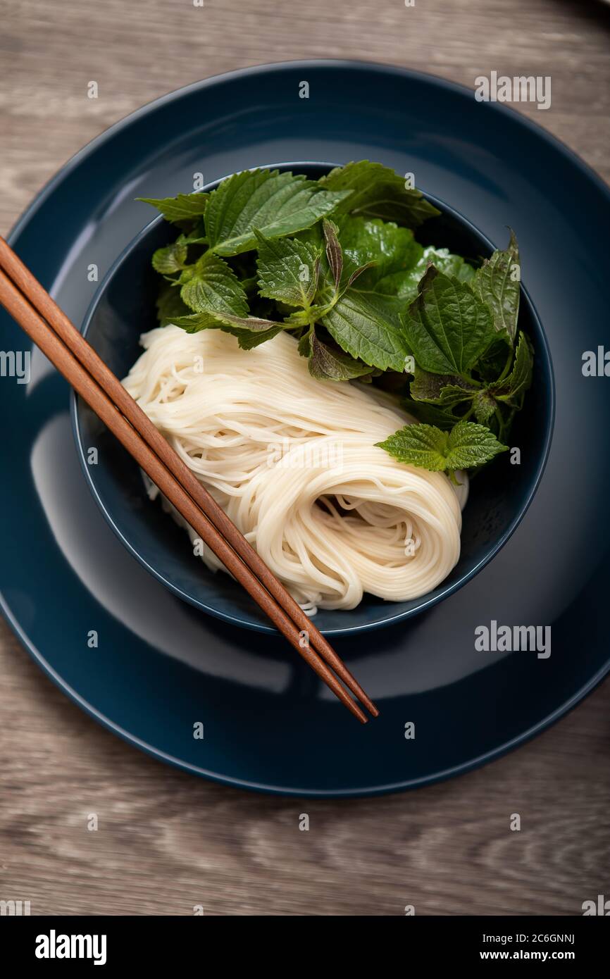 korean noodle on the table (with perilla leaf Stock Photo - Alamy