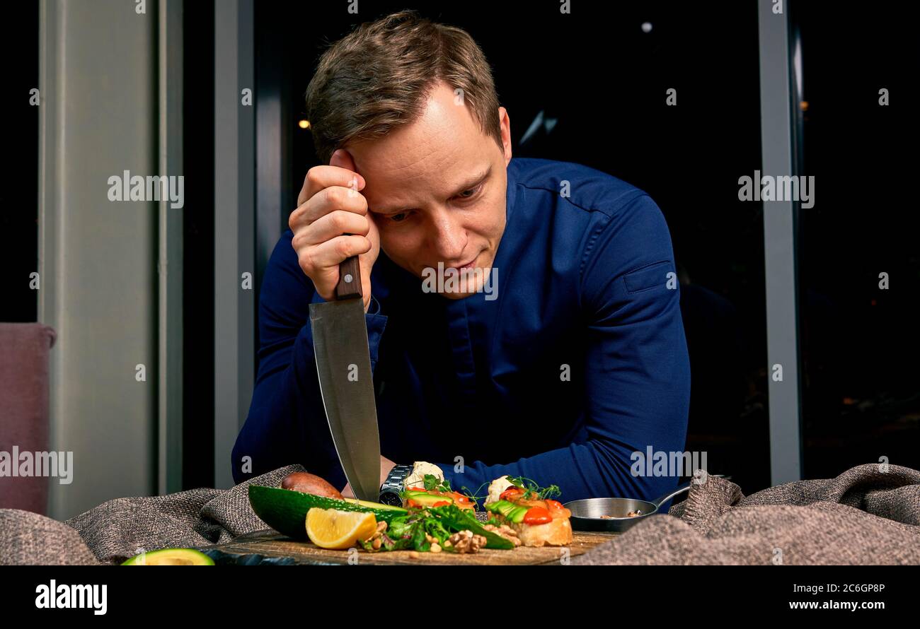 tired chef in a restaurant Stock Photo - Alamy