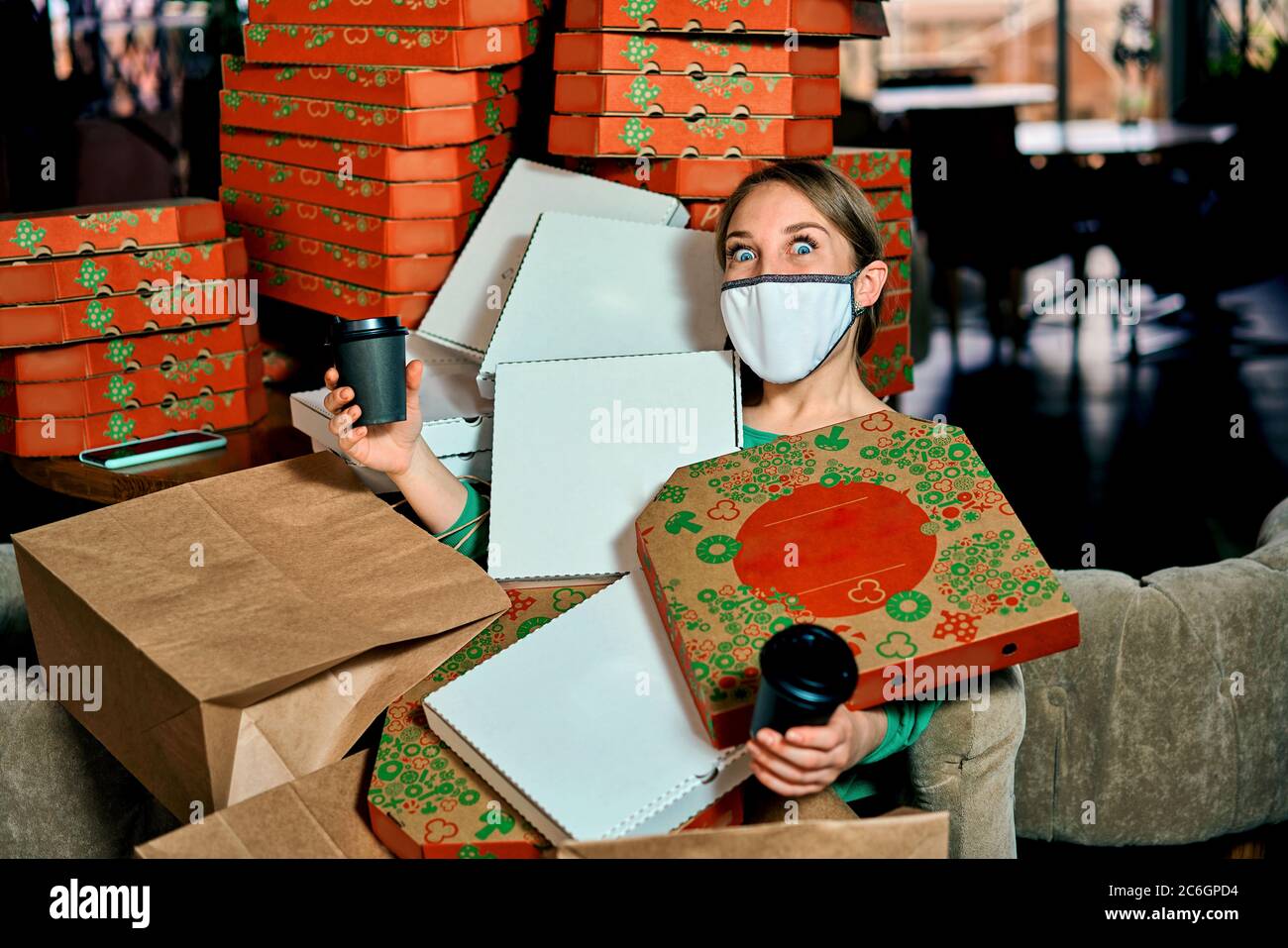 the food delivery girl is covered in boxes Stock Photo - Alamy