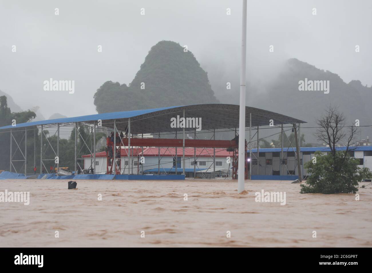 Heavy rain floods a village in Guilin city, south China's Guangxi ...