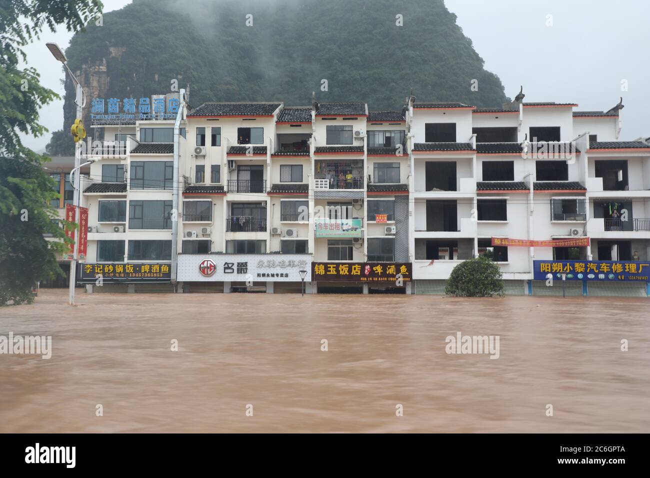 The first floor of a residence building is flooded by heavy rain in a ...