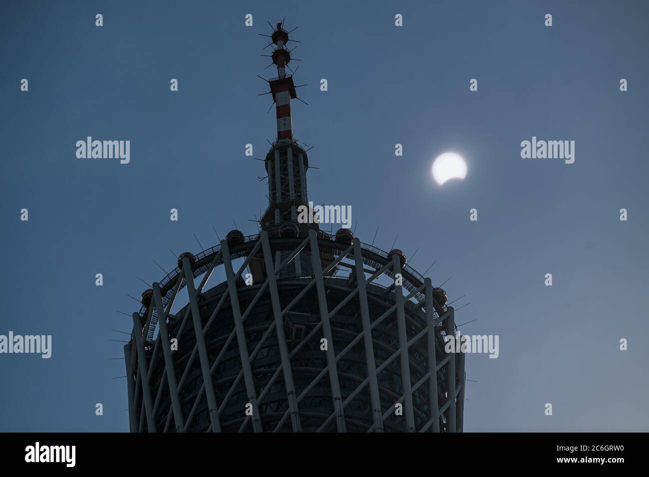 A solar eclipse is captured in Guangzhou city, east China's Guangdong ...