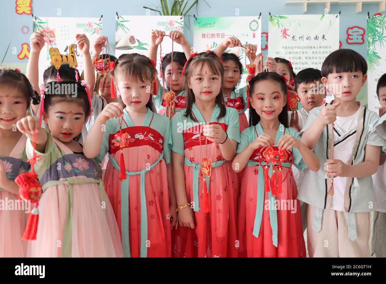 Dressed in ancient Chinese clothes, children at a local kindergarten ...