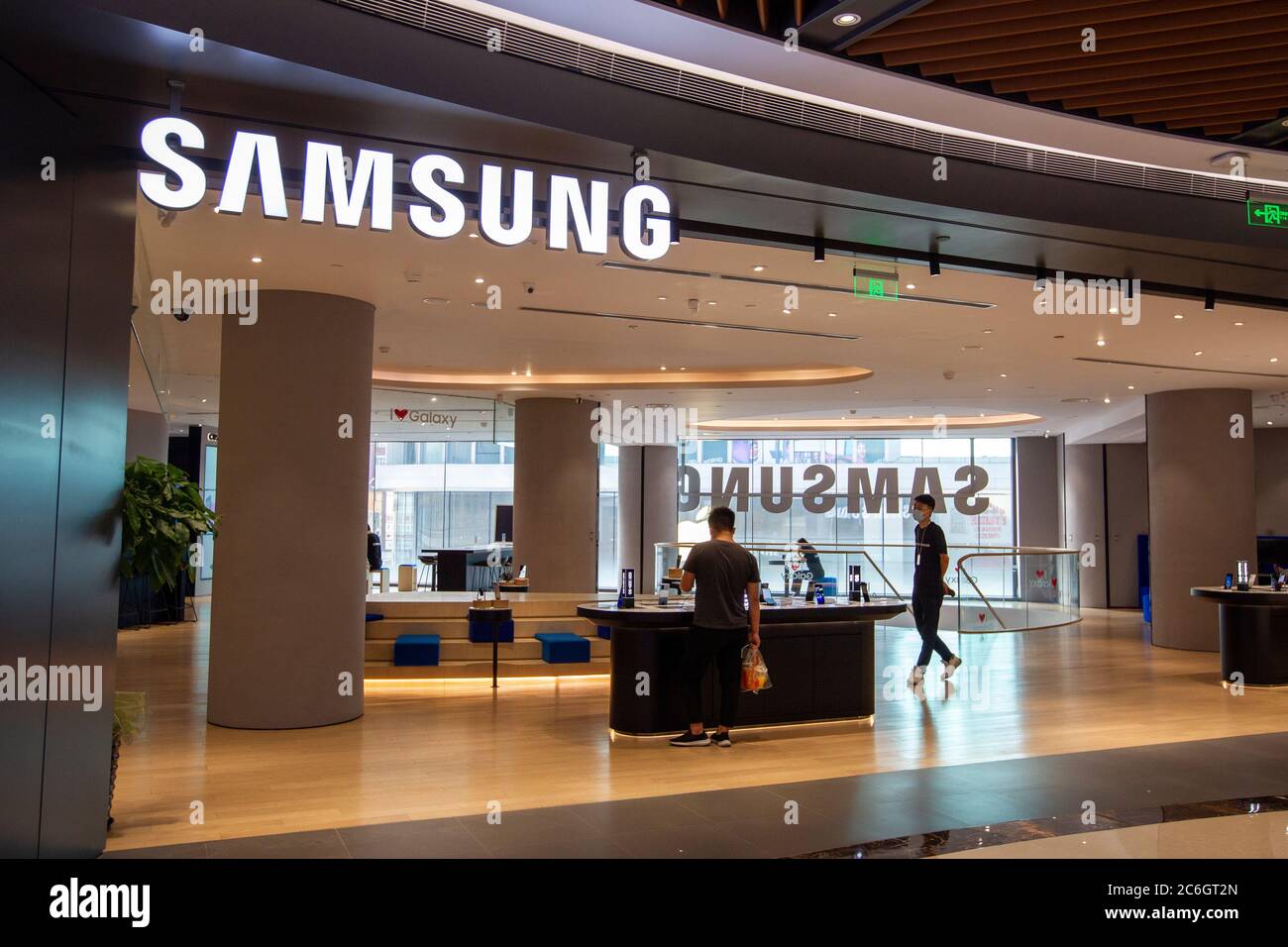 People experience Samsung 5G phone at a Samsung 5G flagship store in ...