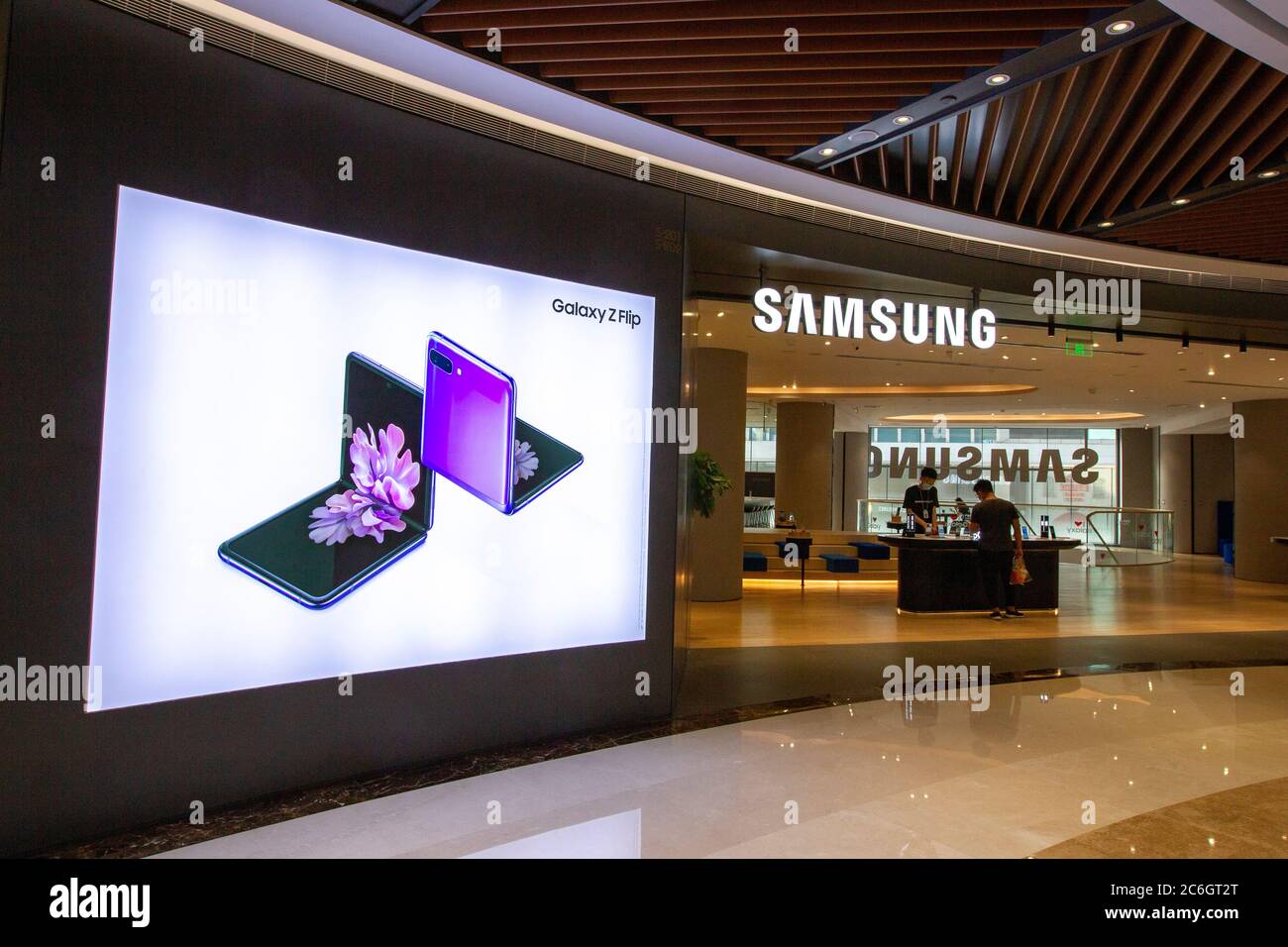 People experience Samsung 5G phone at a Samsung 5G flagship store in ...