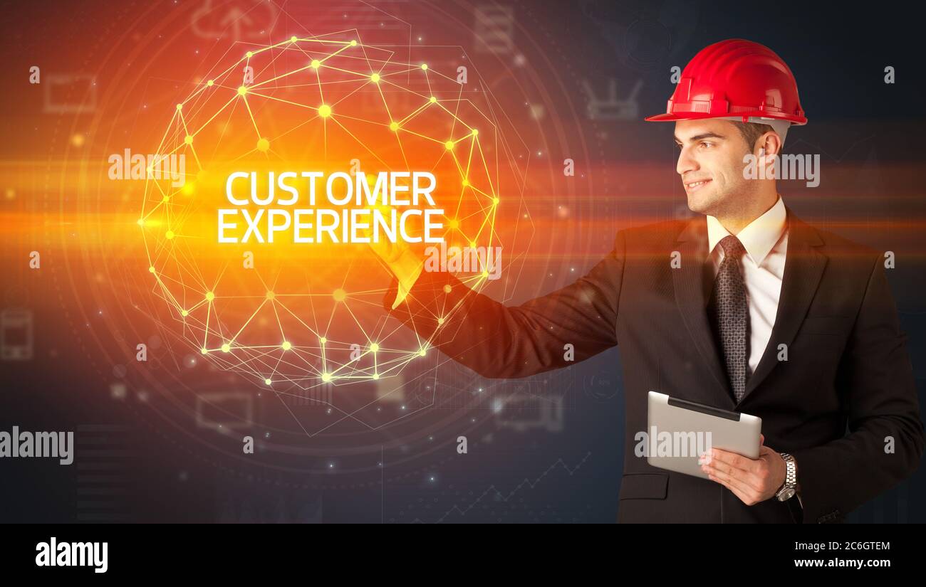 Handsome businessman with helmet drawing CUSTOMER EXPERIENCE ...