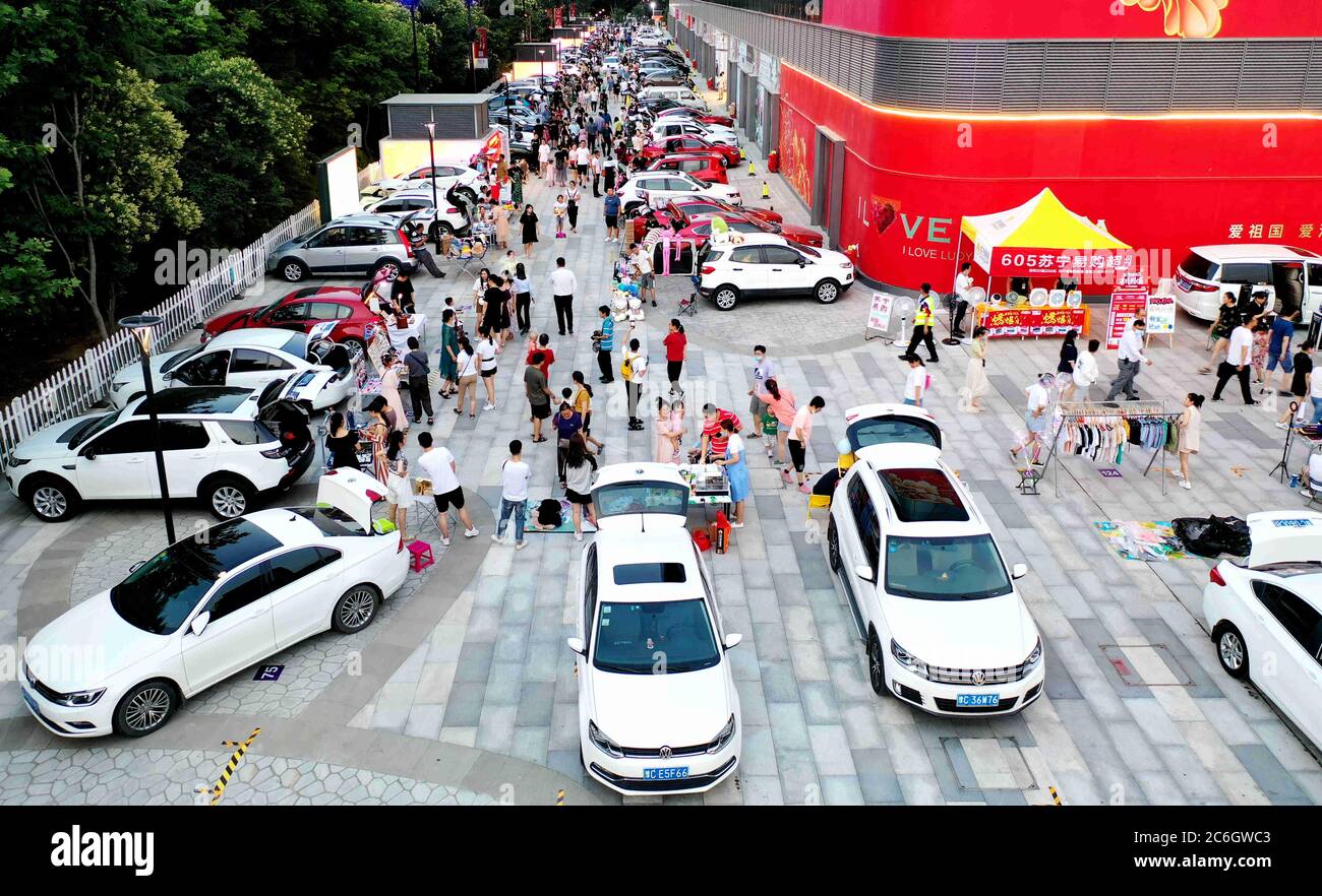 An aerial view of cars, among which there are limousines including Benz ...