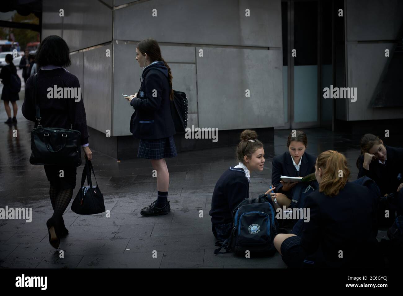 Street photography. Teenage high school girls hang out in their lunch ...