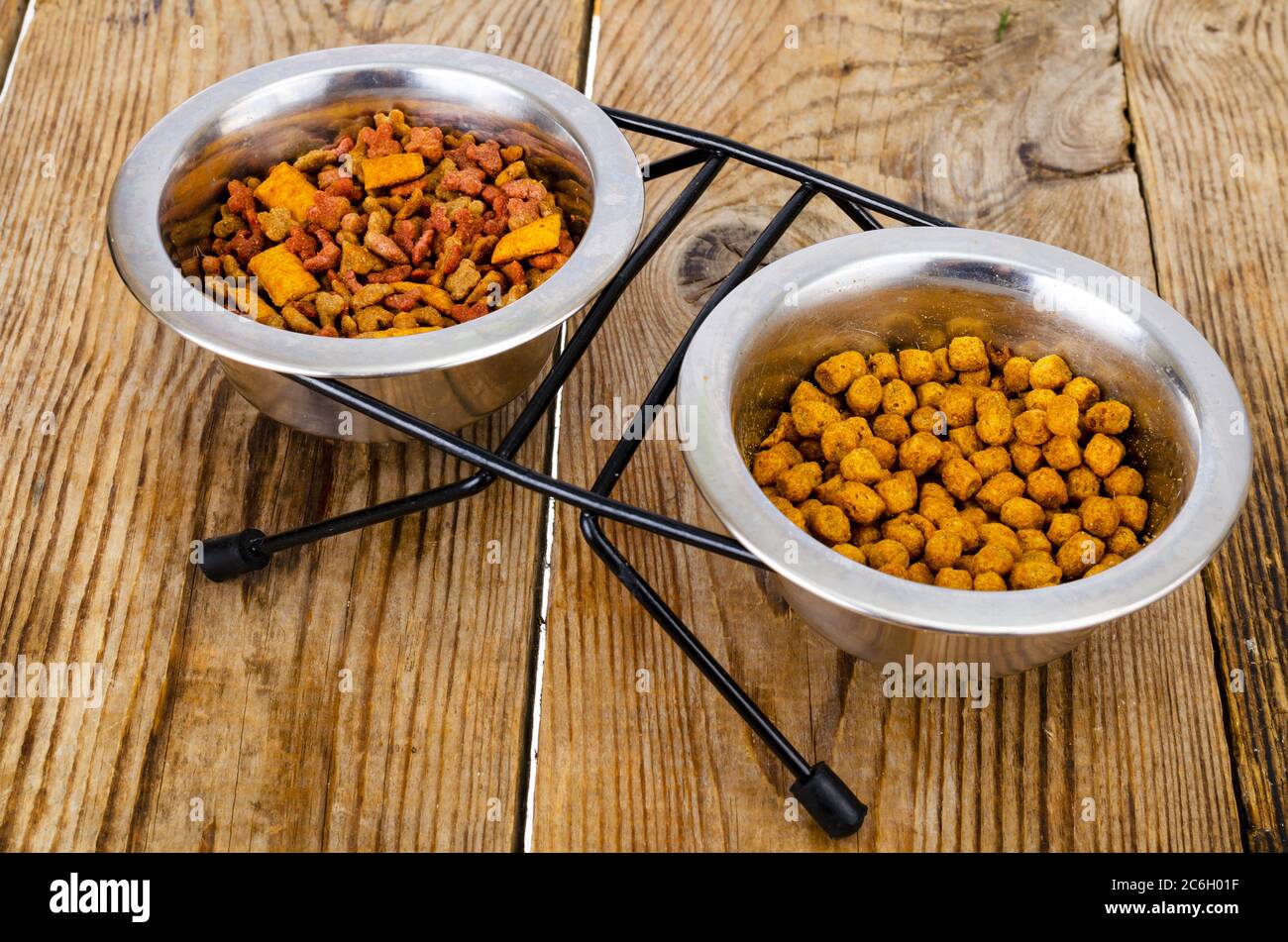 Granular pet food on brown wood background Stock Photo - Alamy