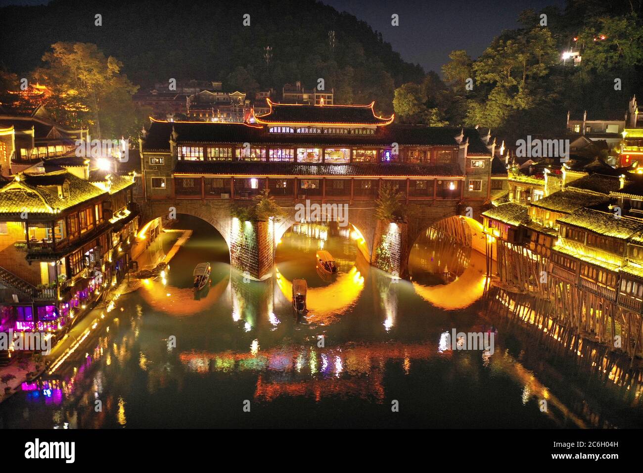 A lighted pavillion is pictured at Fenghuang Ancient Town in Xiangxi ...