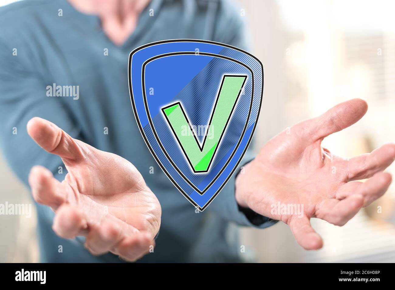 Security approval concept above the hands of a man in background Stock ...