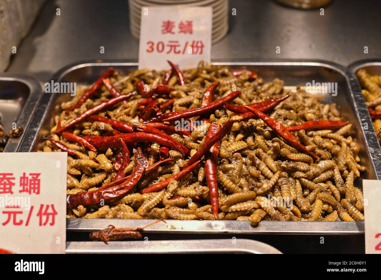 Deep fried insects are sold at a night market in Nanning city, south ...