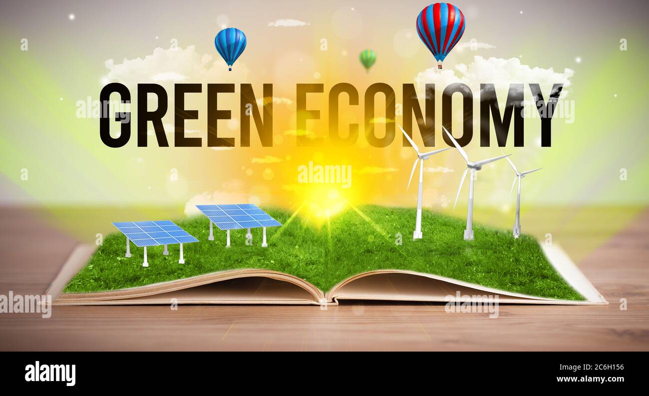 Open book with GREEN ECONOMY inscription, renewable energy concept ...