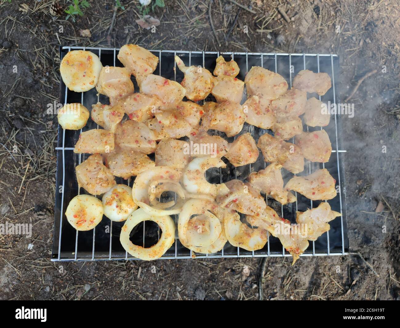 meat on barbecue grill in the forest Stock Photo - Alamy