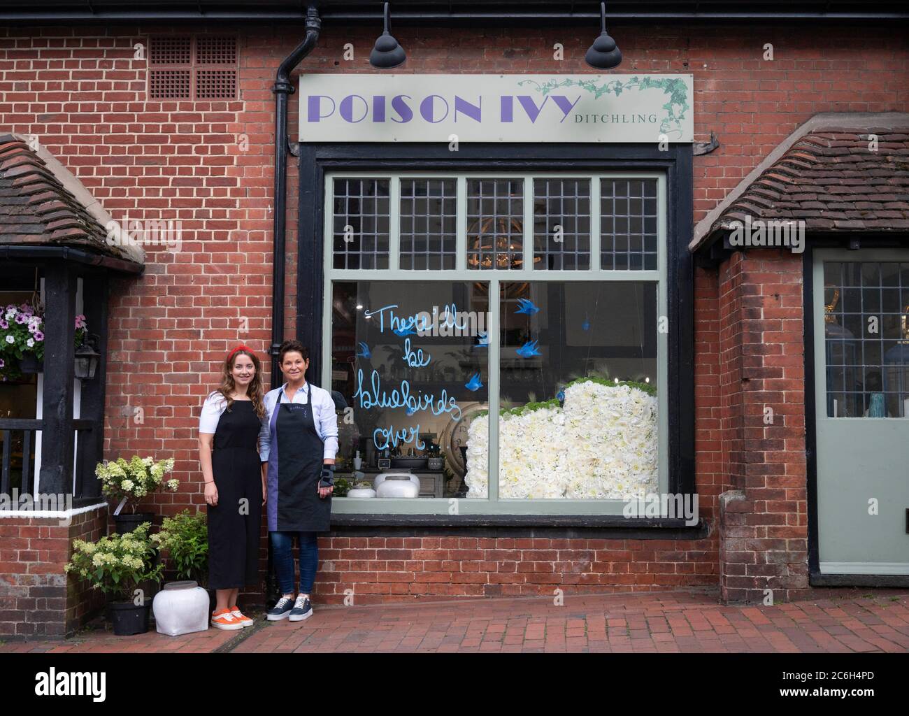 Ditchling Sussex UK 10th July 2020 - Sam Barker owner of Poison Ivy florists and manager Hannah ...