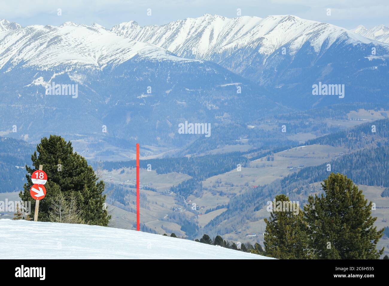 Red post sign marking the edge of ski slope Stock Photo - Alamy