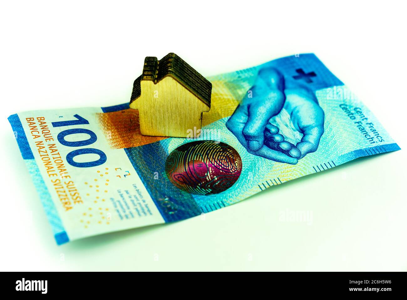Swiss frank banknote with a miniature wooden house on it Stock Photo ...