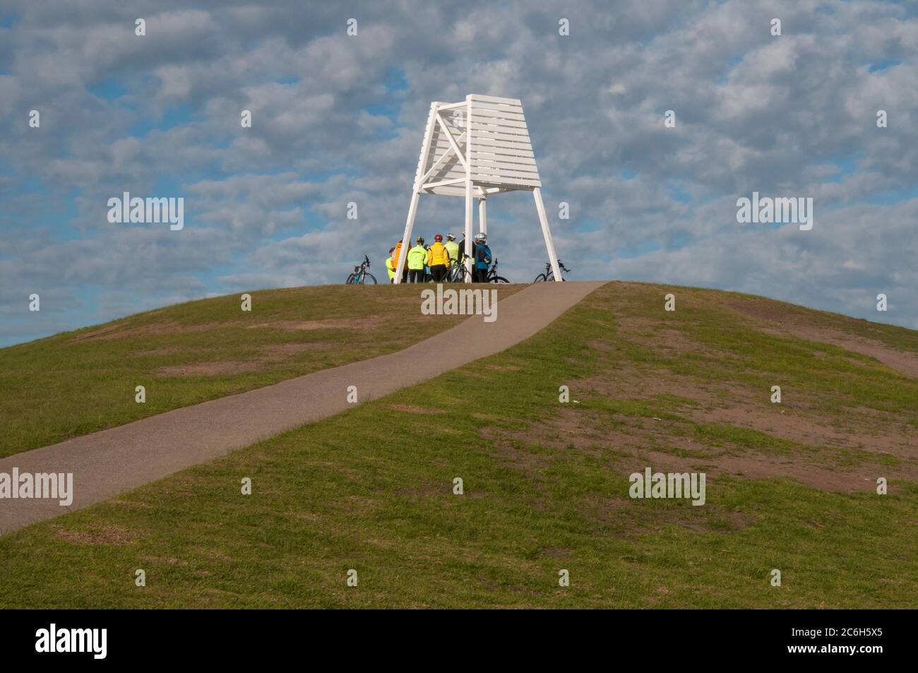 Joggers and cyclists meet at the tower on Point Ormond on Port Phillip ...