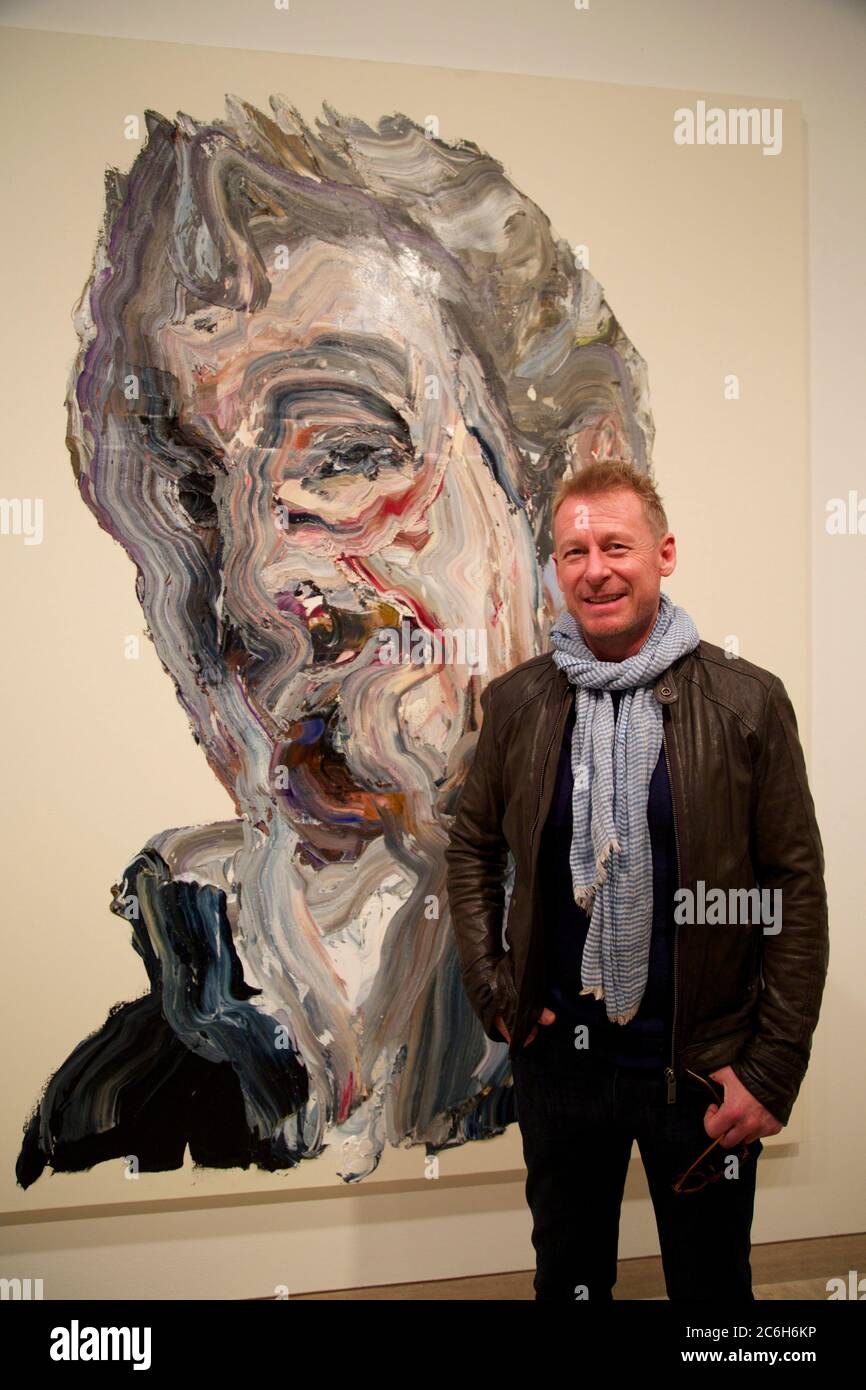 Actor Richard Roxburgh standing in front of the painting of him by ...