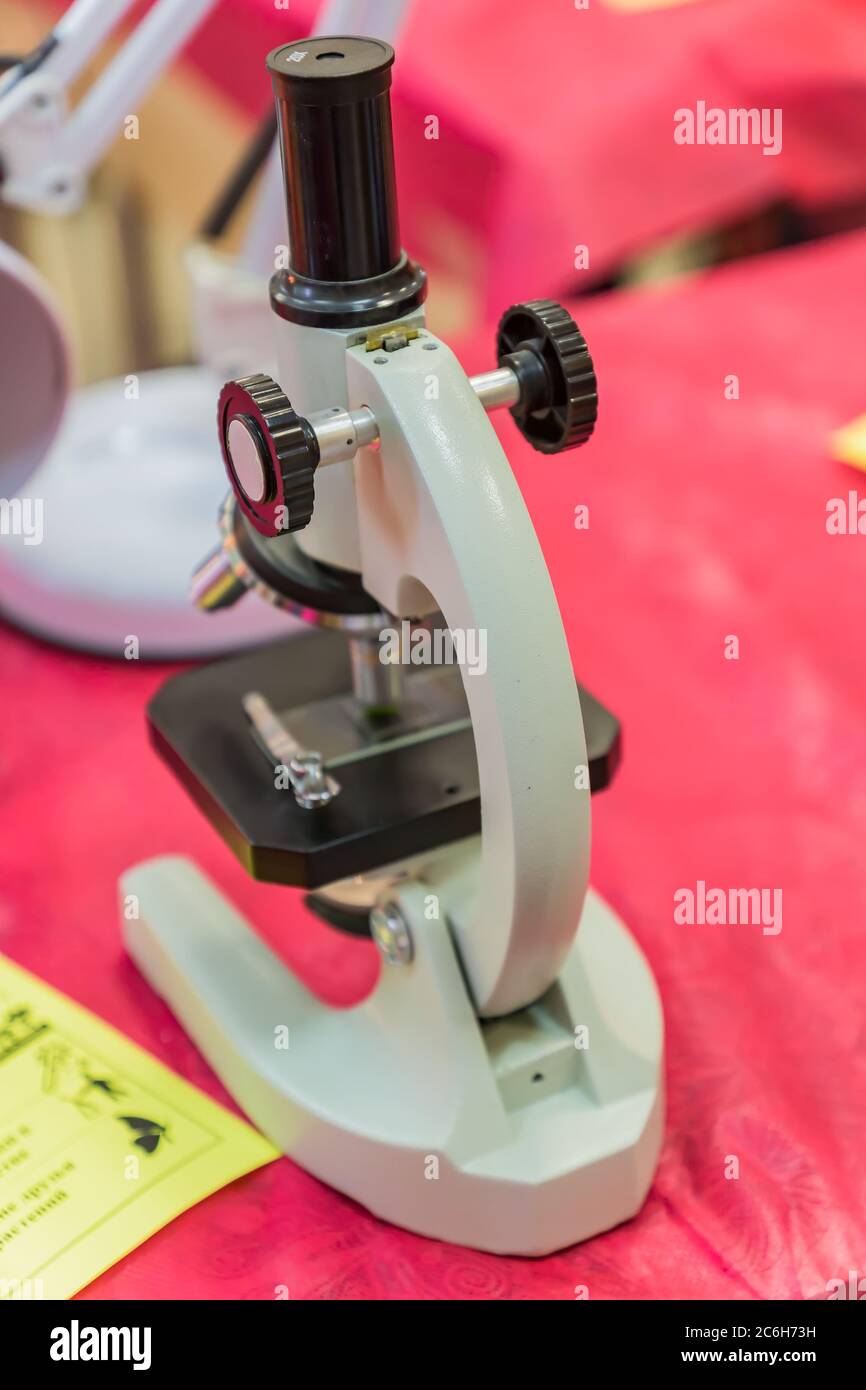 Laboratory Equipment, Optical Microscope for school lessons on red ...