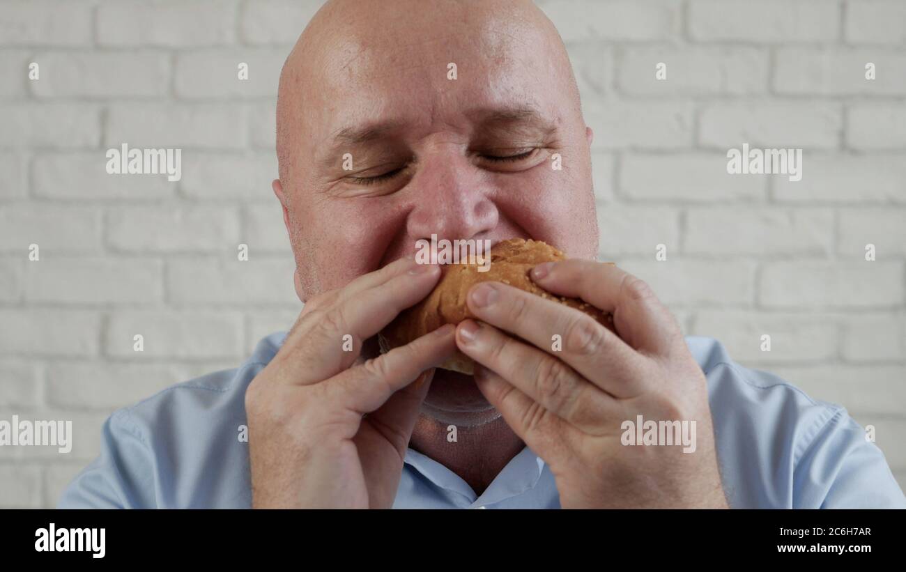 Greedy man eating hi-res stock photography and images - Alamy
