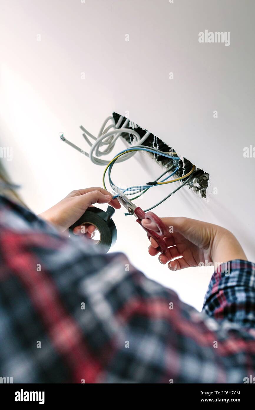 Woman hand scissors cable hi-res stock photography and images - Alamy