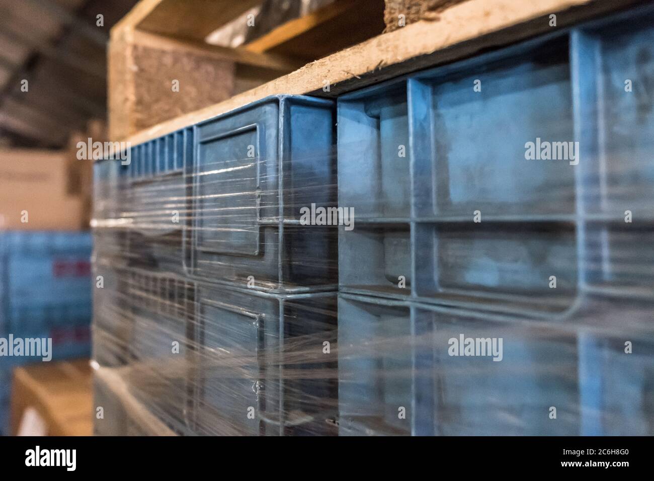 Close-up, shallow focus of blue plastic shipping crates seen within a ...