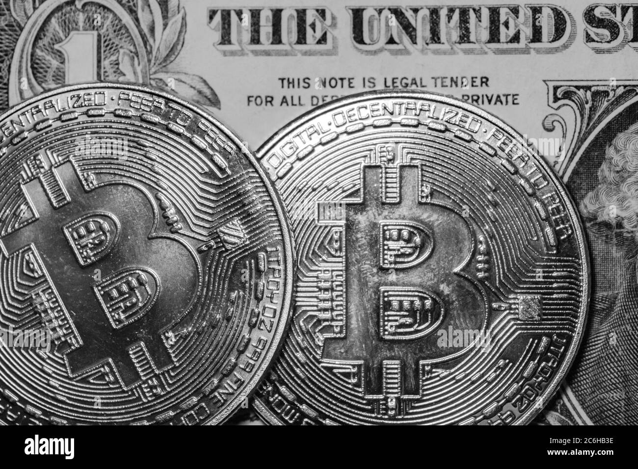 Image of Bitcoin crypto currency seen laying on a regular One Dollar ...