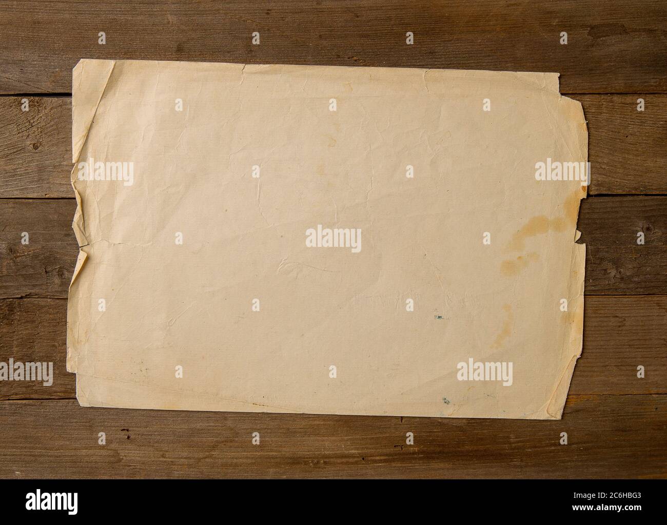 old shabby empty sheet of paper on a rough wooden table Stock Photo - Alamy