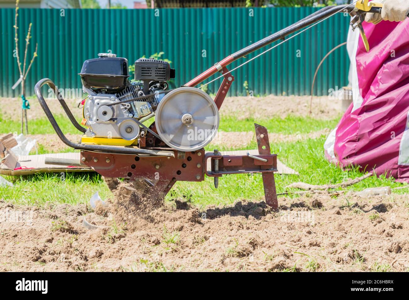 close up of a tractor (motoblock) plowing the field Stock Photo - Alamy