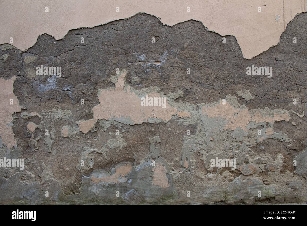 Old dirty weathered wall with layers of plaster falling off ready for ...