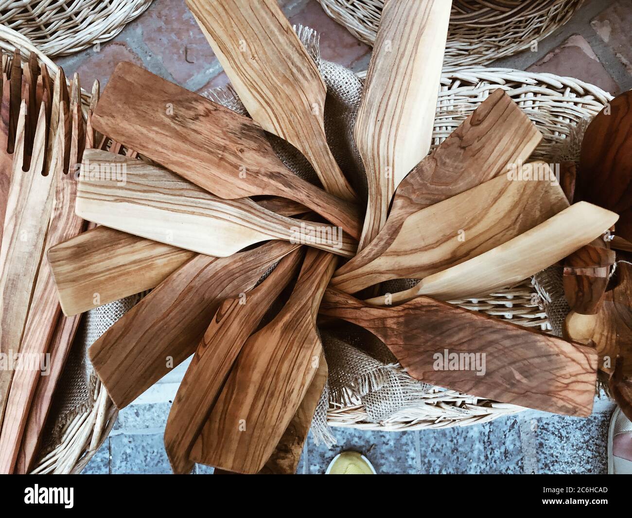 Traditional souvenir objects. Wooden spoons knitted basket Stock Photo ...