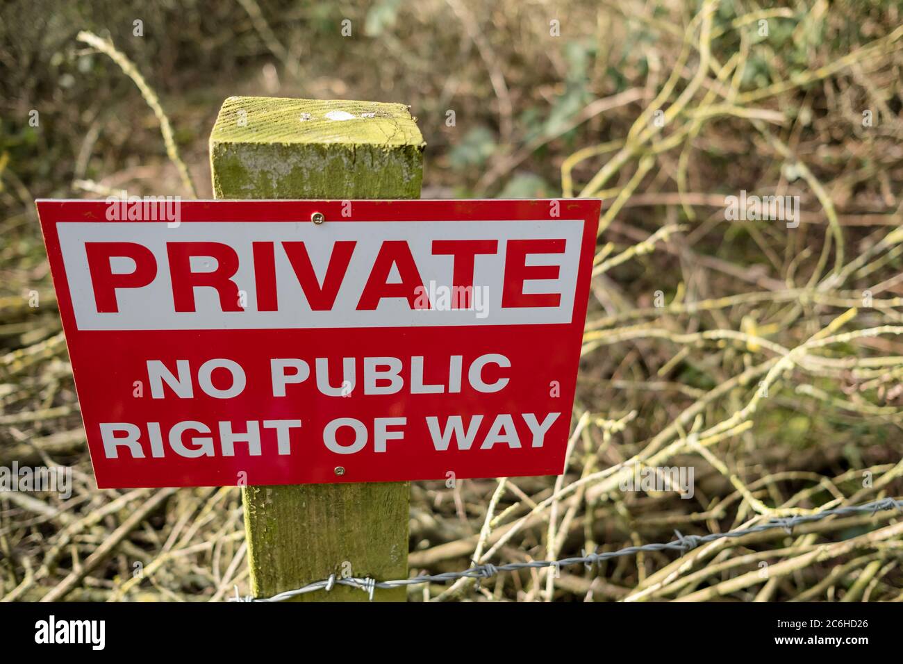 Newly fitted Private sign seen attached to a wooden post and barbed ...