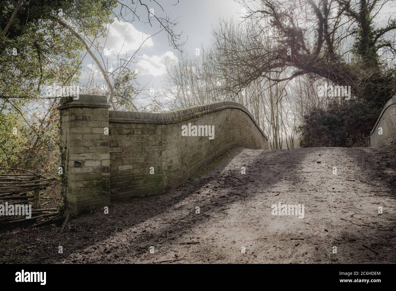 Details view of an old brick work footbridge showing its weathered wall ...
