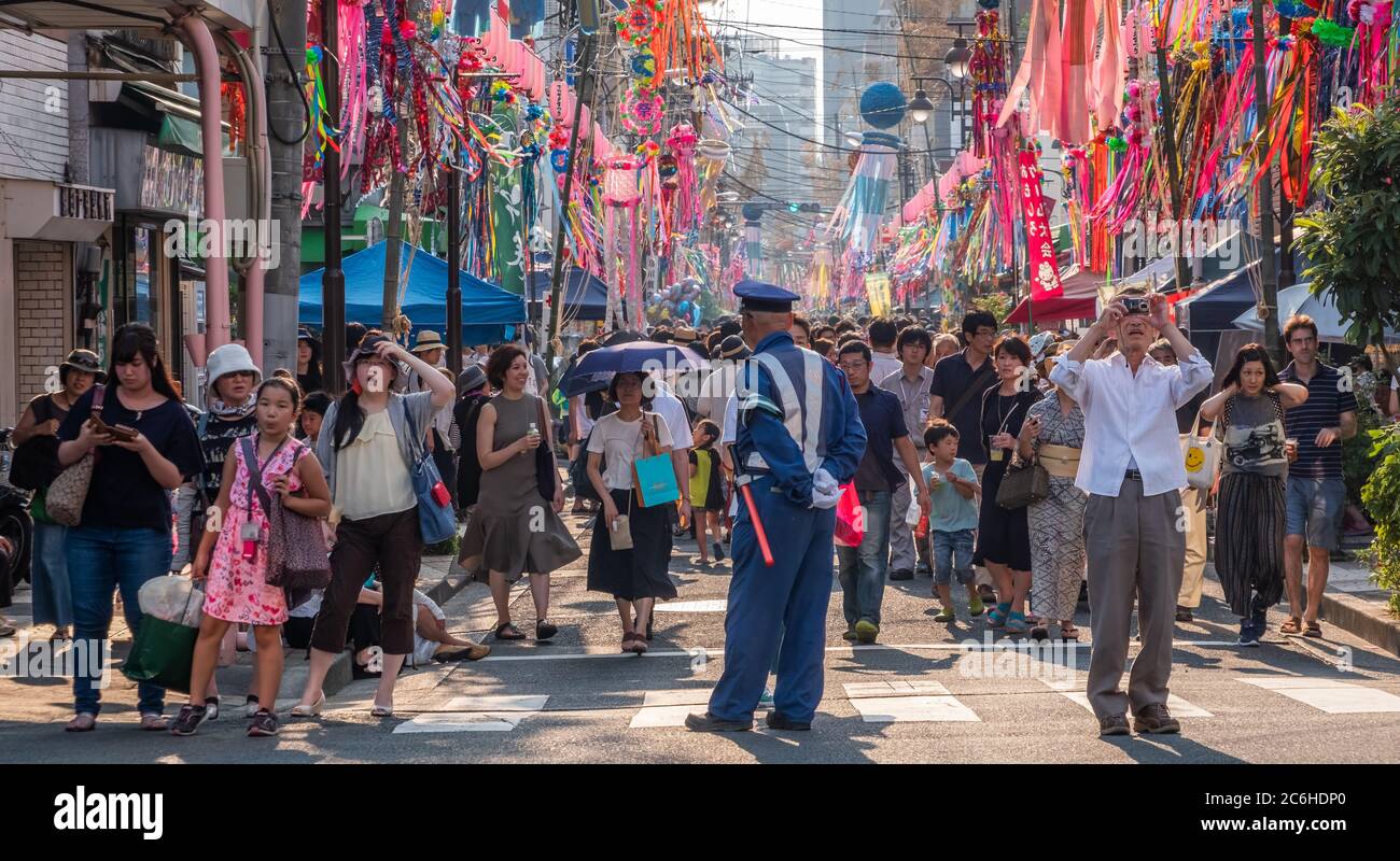 Crowd of people at Shitamachi Tanabata Matsuri festival in the street ...