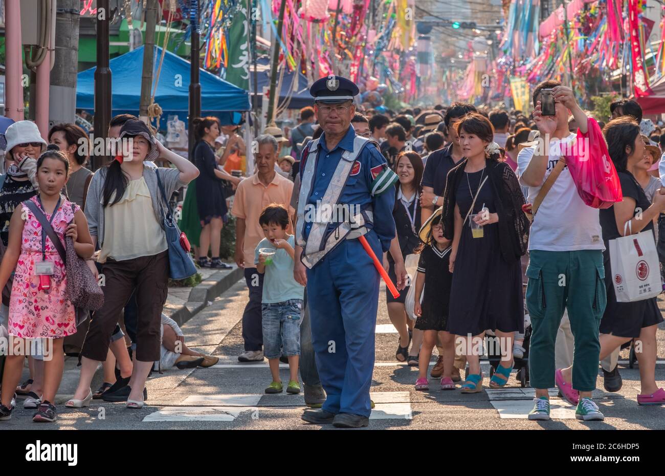 Crowd of people at Shitamachi Tanabata Matsuri festival in the street ...