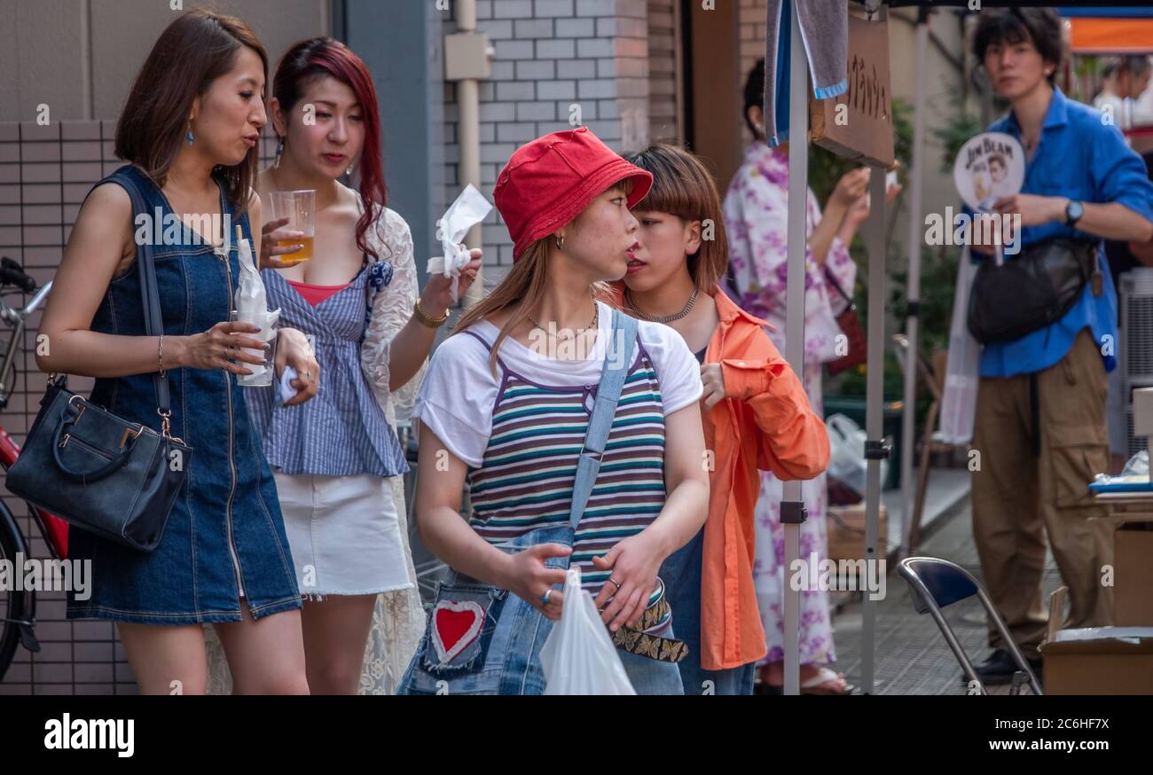 Visitors walking in a hot summer's day at Shitamachi Tanabata Matsuri ...