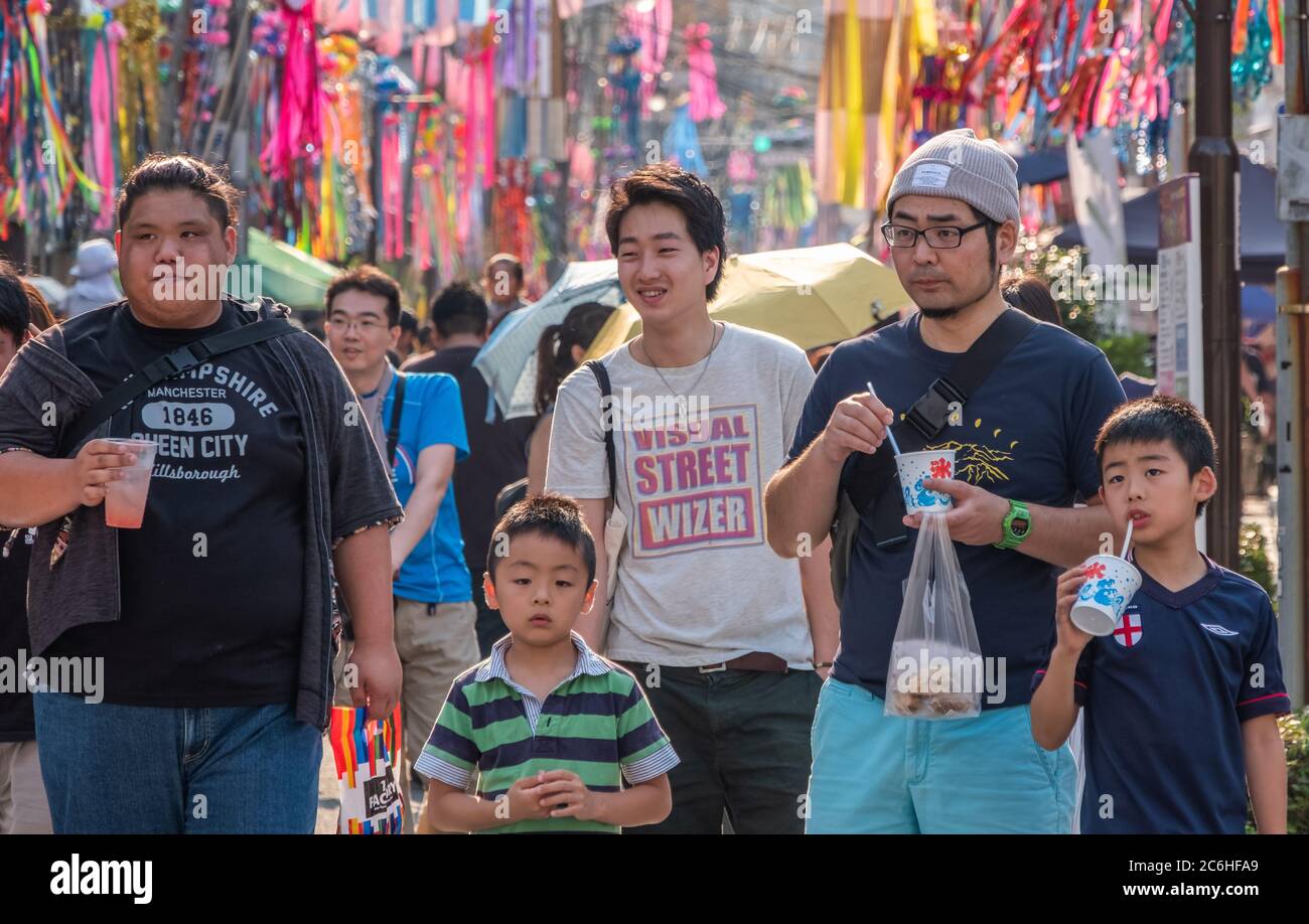 Visitors walking in a hot summer's day at Shitamachi Tanabata Matsuri ...