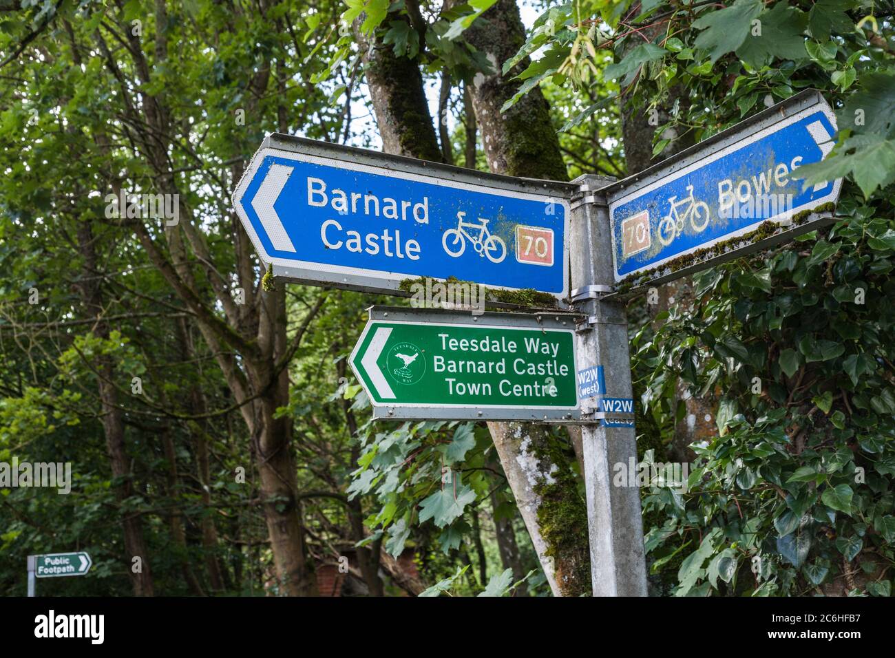Cycle path signs for Barnard Castle and Bowes on the riverbank at ...