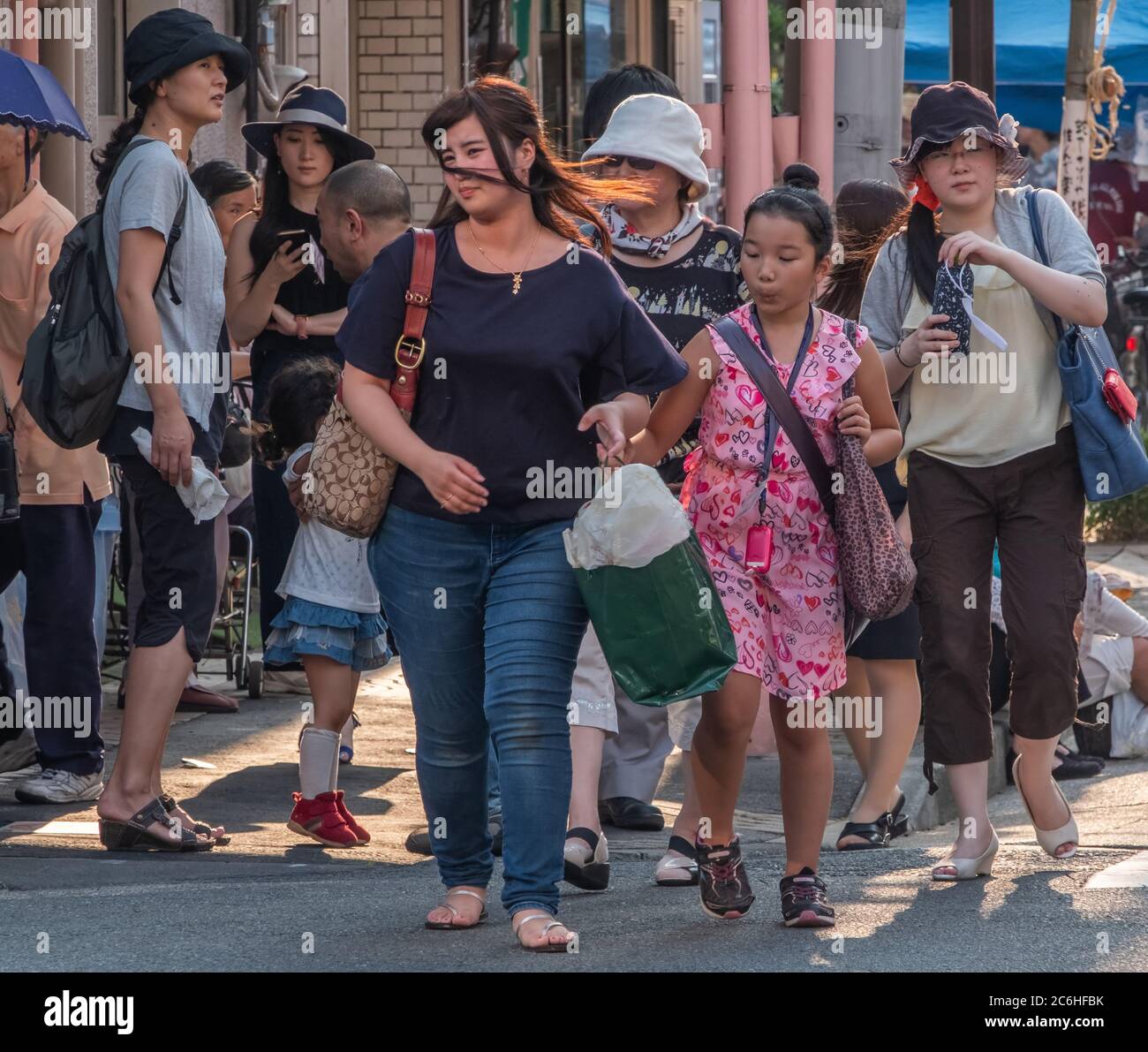 Visitors walking in a hot summer's day at Shitamachi Tanabata Matsuri ...