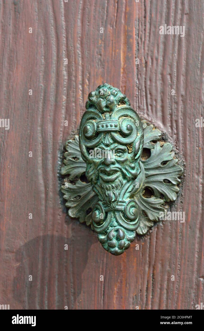 Devil, Ancient door knob from Venice, Italy Stock Photo - Alamy