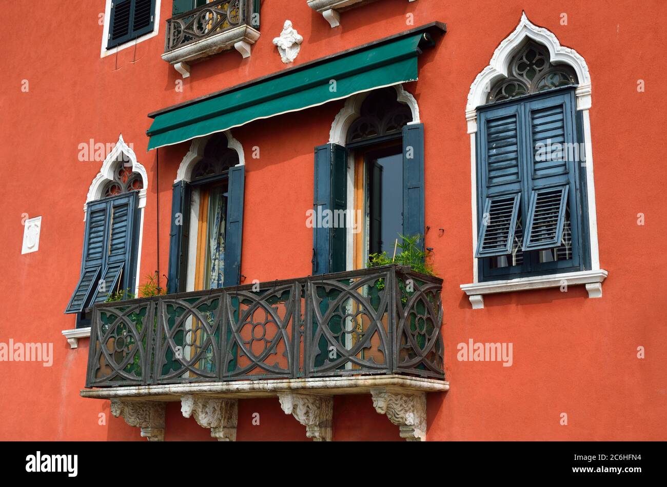 The classical facade with windows and typical balcony of the historic ...
